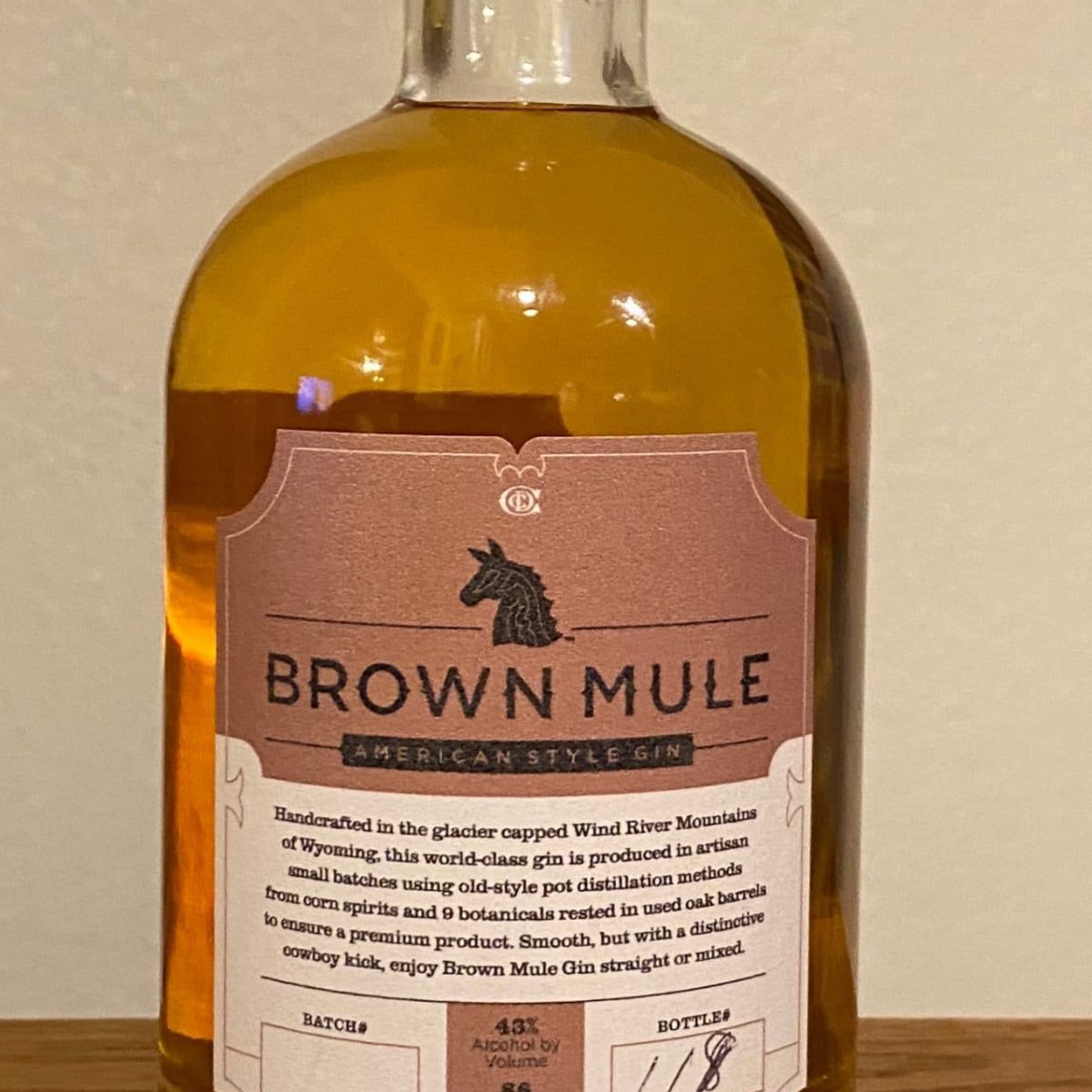 Gins distilled from a base spirit of corn